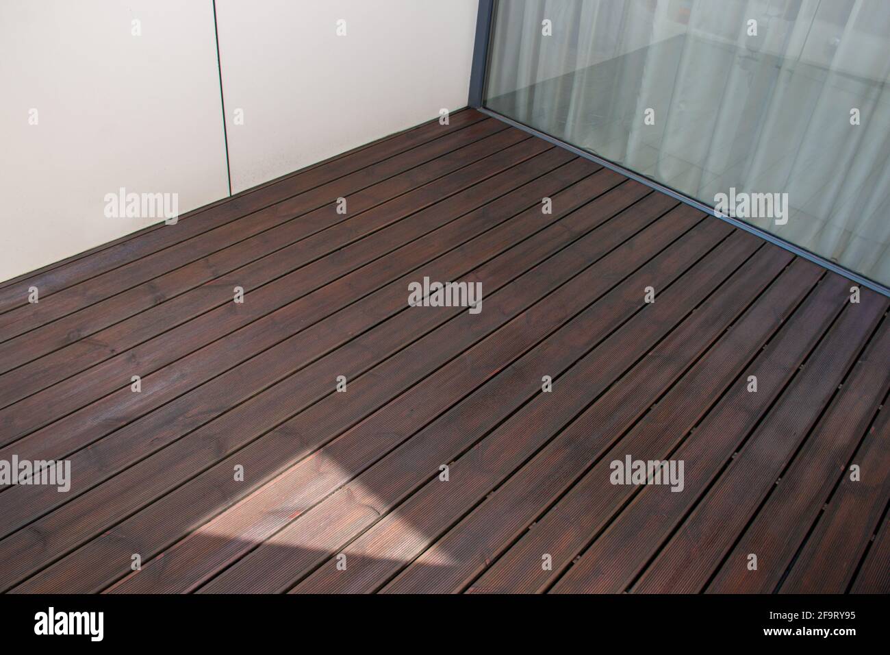 Pine wood deck, treated softwood decking terrace contrasting with white ...