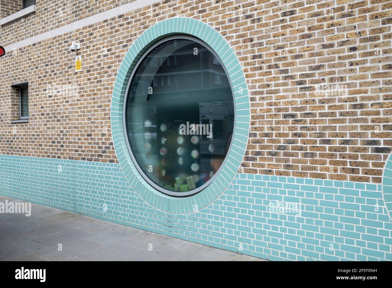 Architectural circular window detail in brickwork in the upmarket area ...