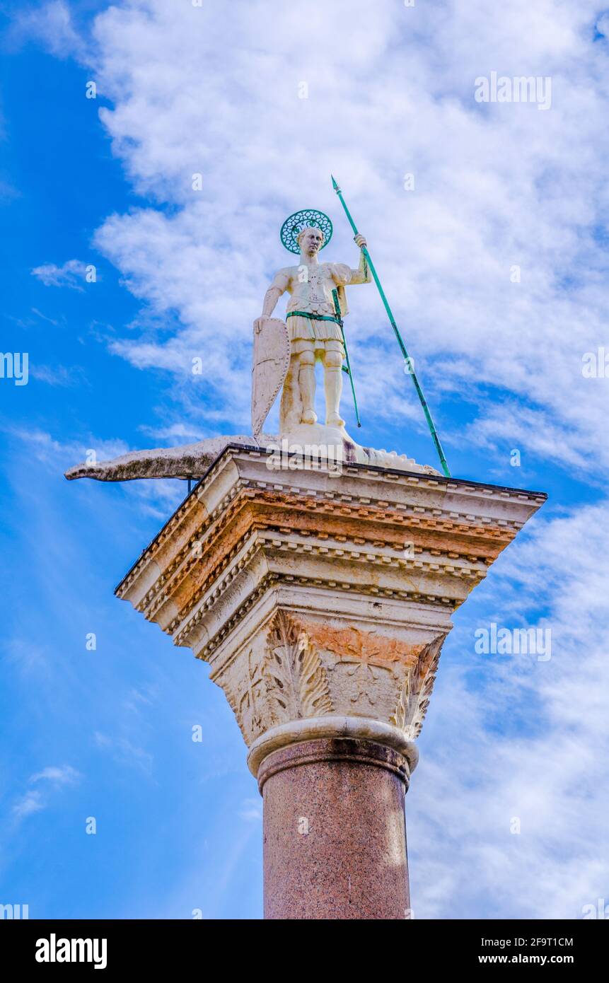 The sculpture of St. Theodore on the top of the west tower, Piazzetta ...