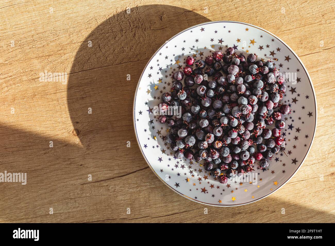 Frozen berries on a plate top view on a wooden background Stock Photo ...