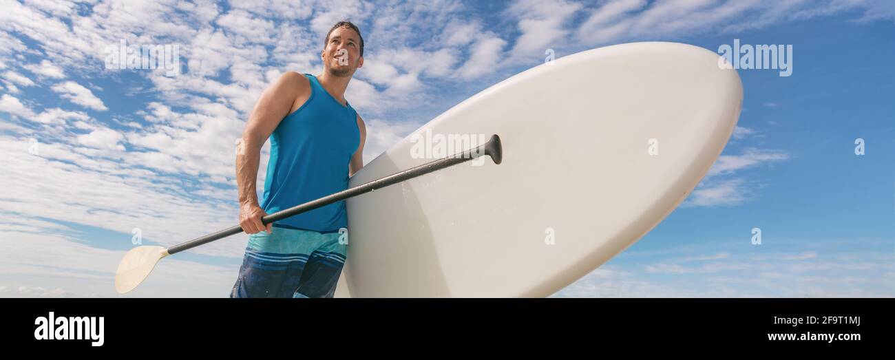 Paddle board SUP fit man carrying paddleboard on hawaii beach banner ...