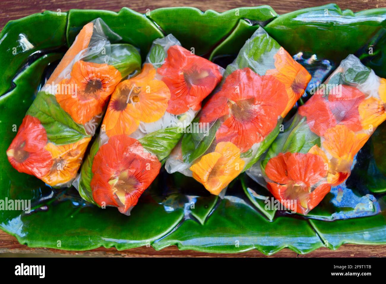 Garden fresh spring rolls filled with colorful nasturtium edible ...