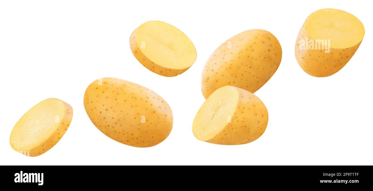 Falling raw potatoes isolated on white background Stock Photo - Alamy