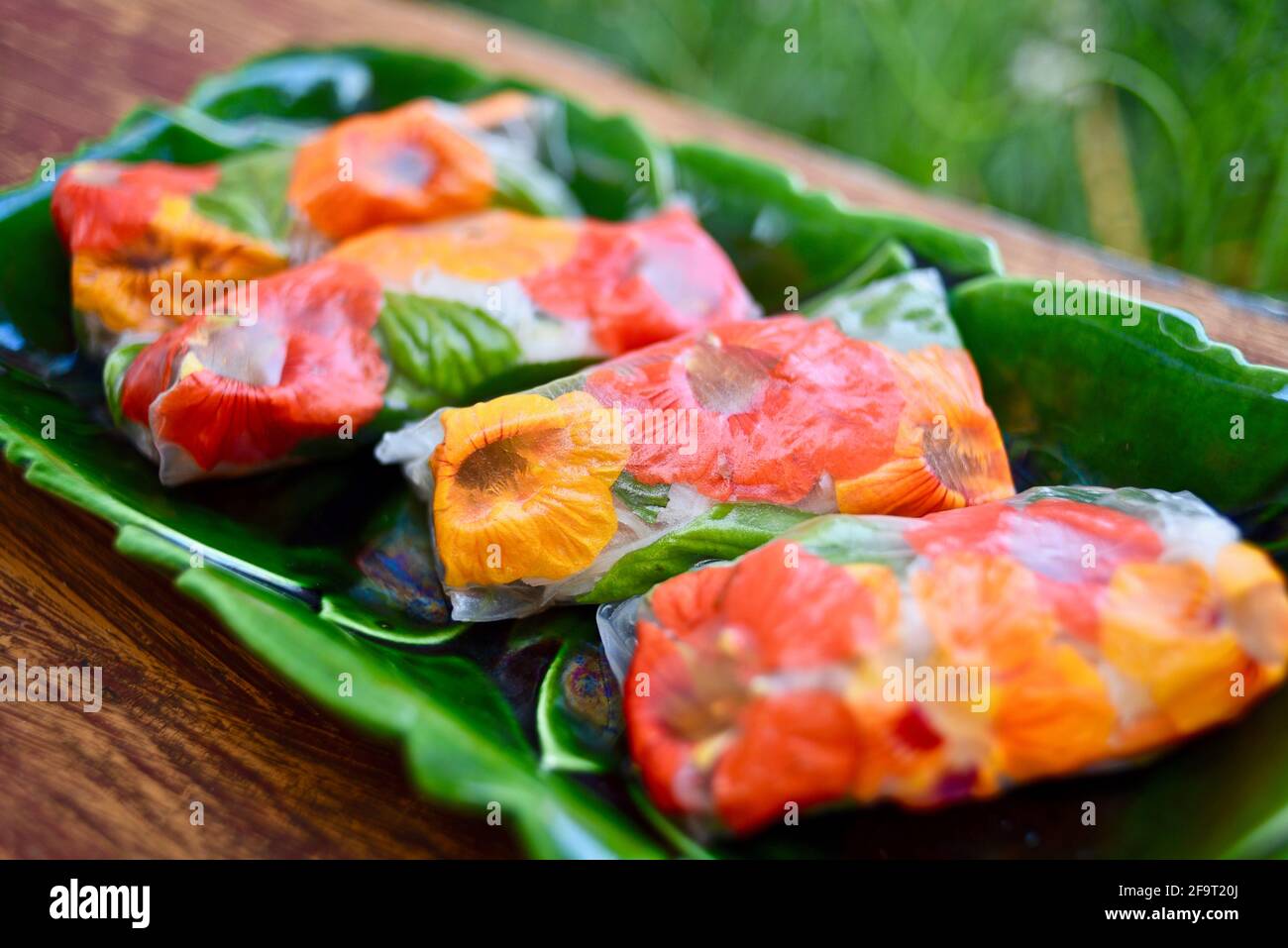 Garden fresh spring rolls filled with colorful nasturtium edible ...