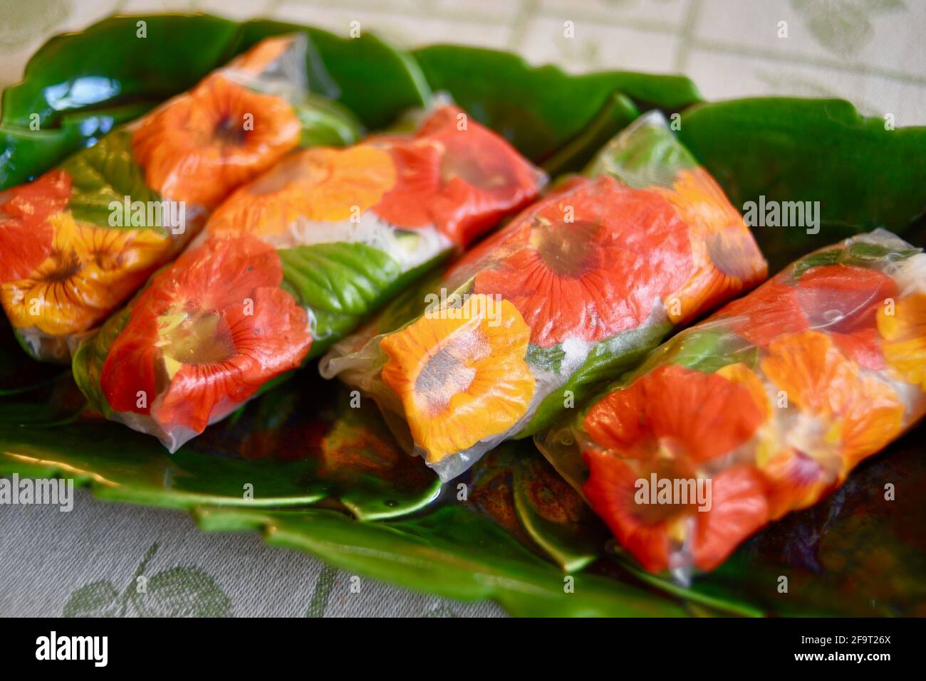 Garden fresh spring rolls filled with colorful nasturtium edible ...