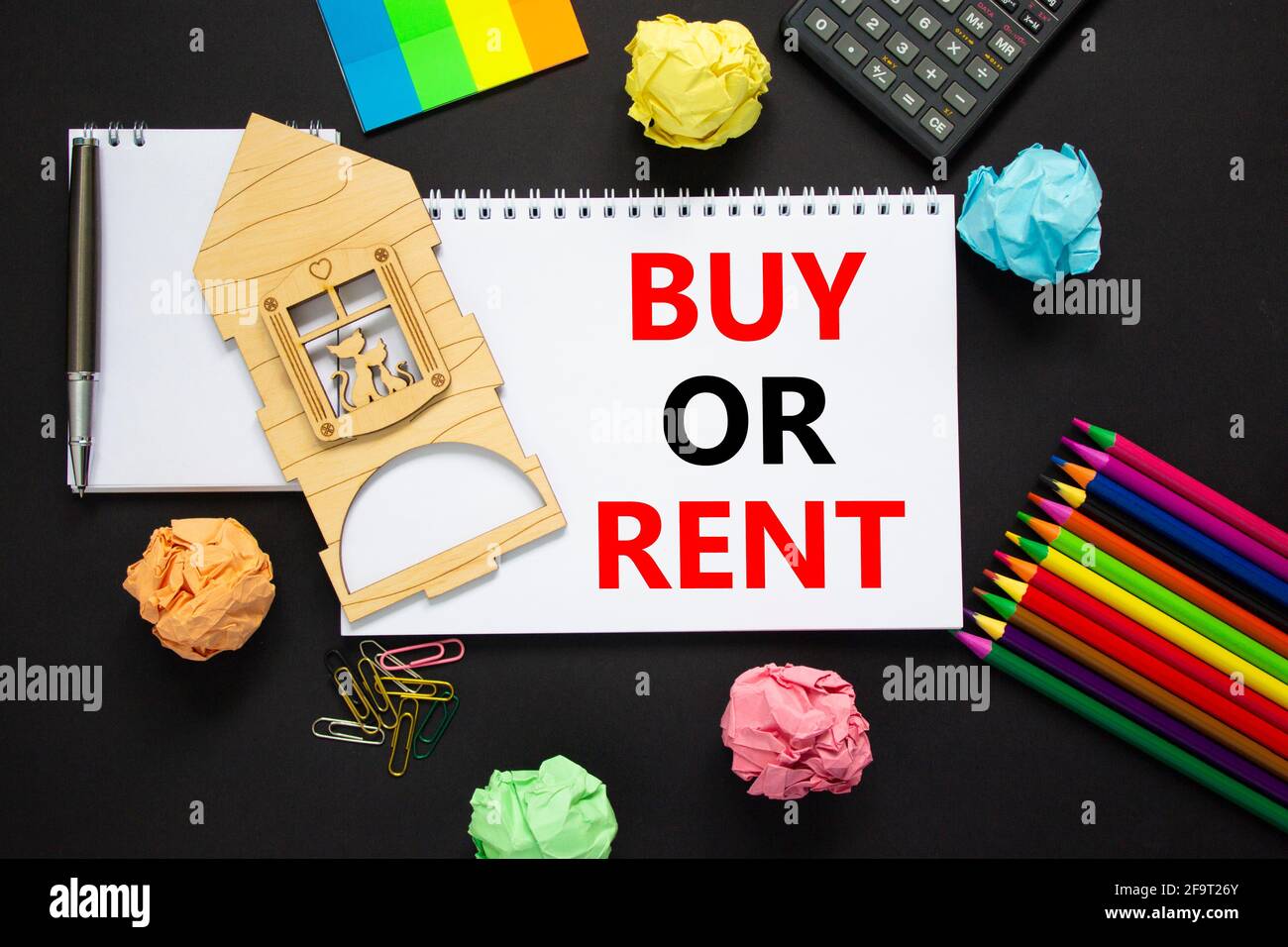 Buy or rent real estate symbol. White note with words 'buy or rent' on ...