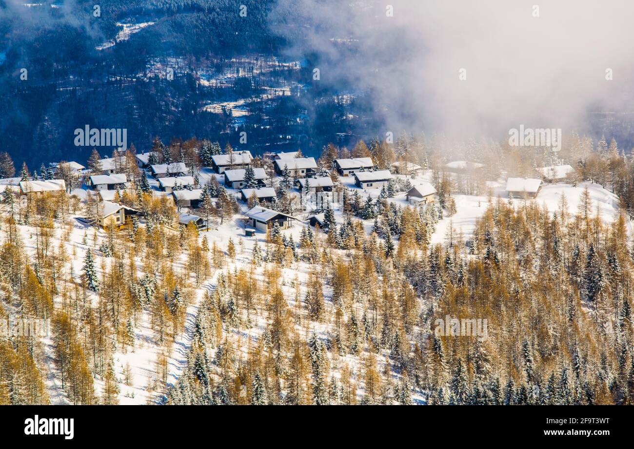 aerial view of several cottages spread across the gerlitzen mountain ...
