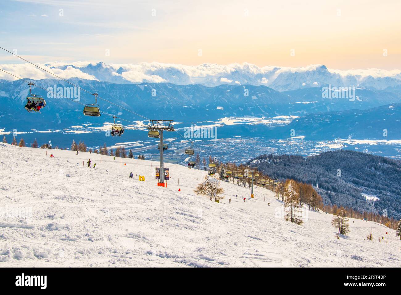 A lift is bringing skiers to top of the gerlitzen mountain in austria ...