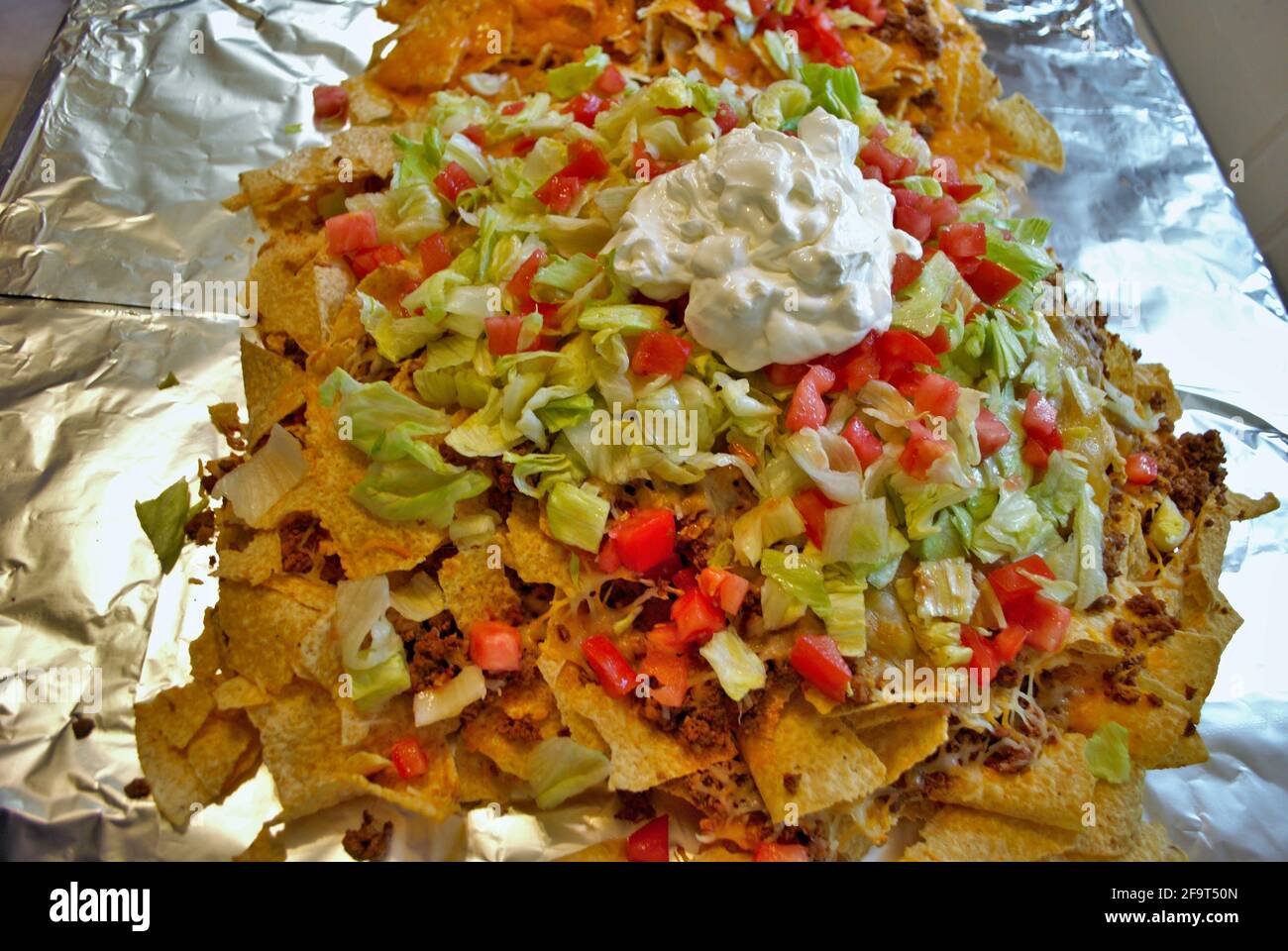 Nacho table kitchen table wrapped in aluminum foil and covered with ...