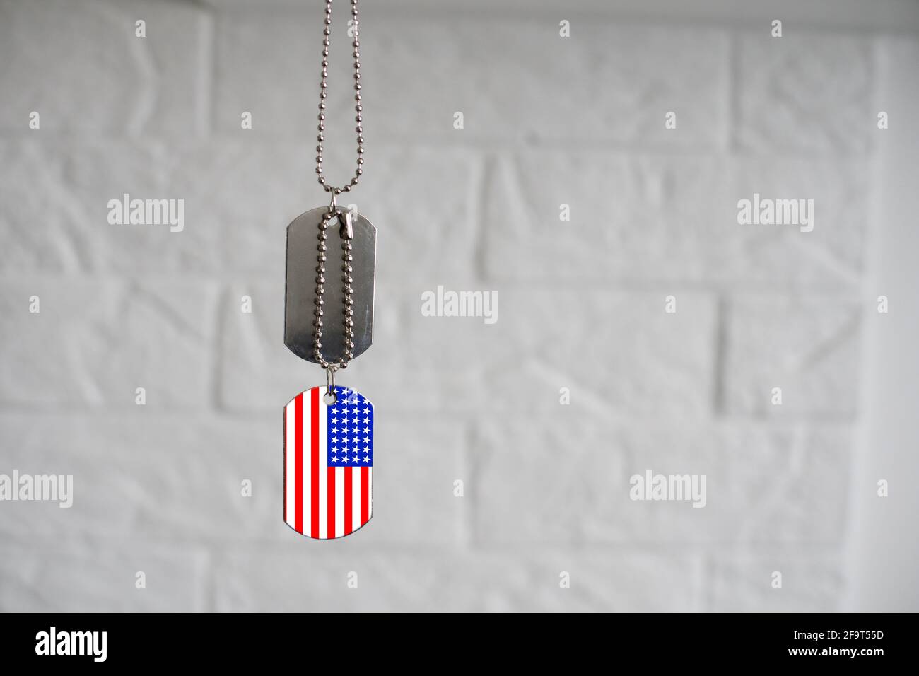 Army tokens on American national flag background Stock Photo - Alamy