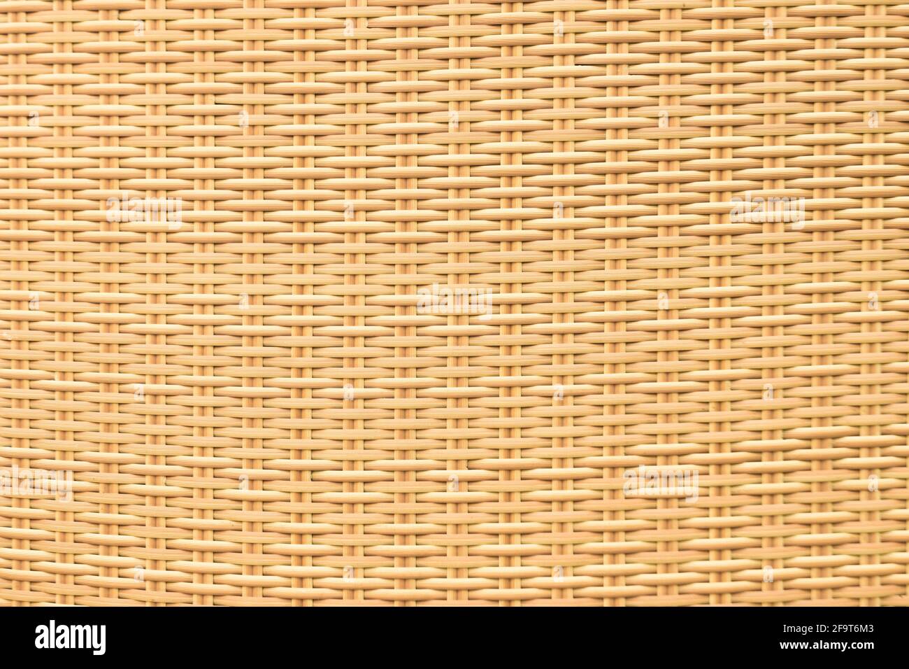 Yellow rattan texture and background Stock Photo - Alamy