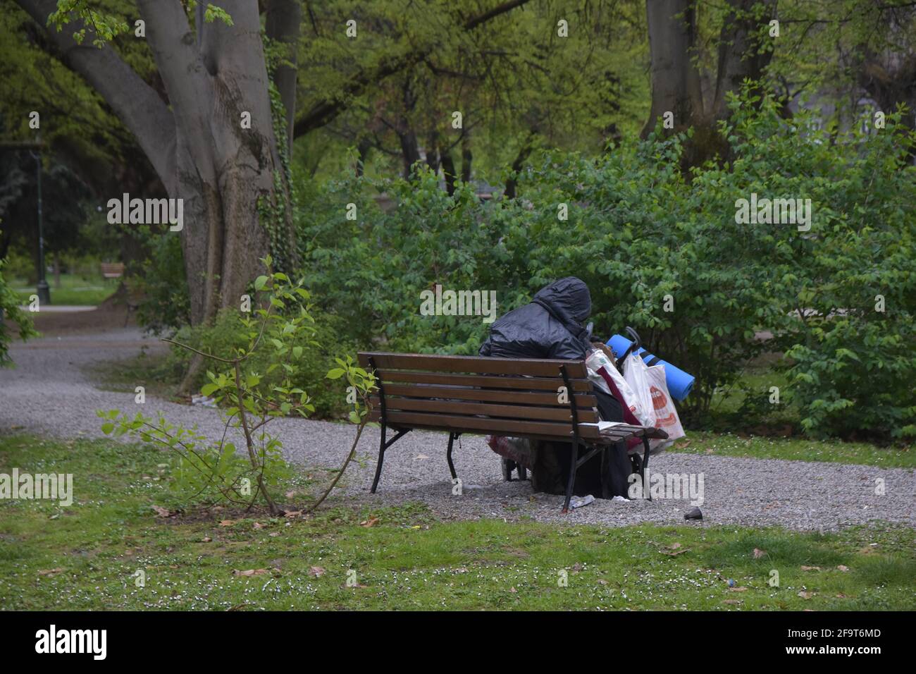 View old homeless man sitting hi-res stock photography and images - Alamy