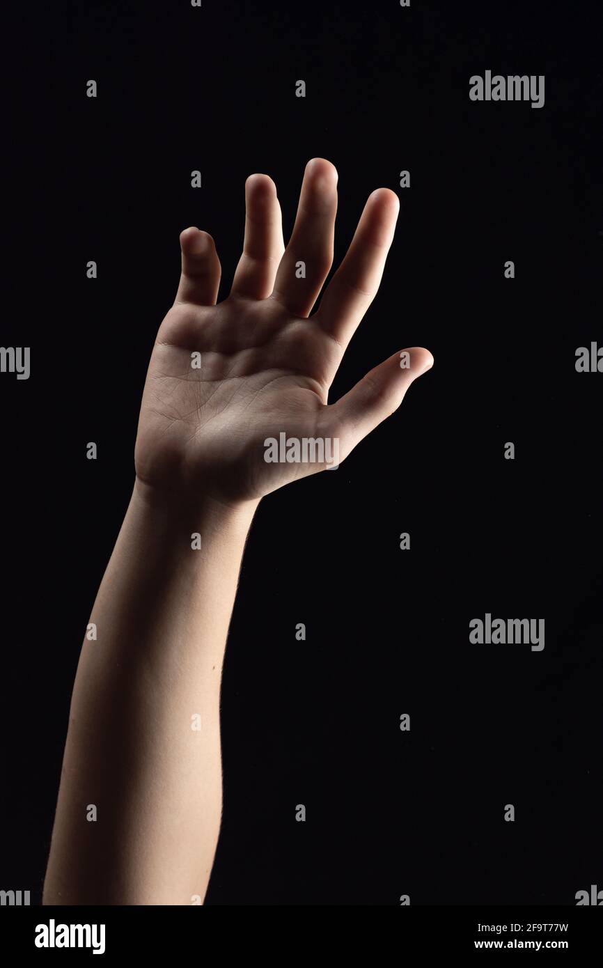 One hand in black background Stock Photo - Alamy