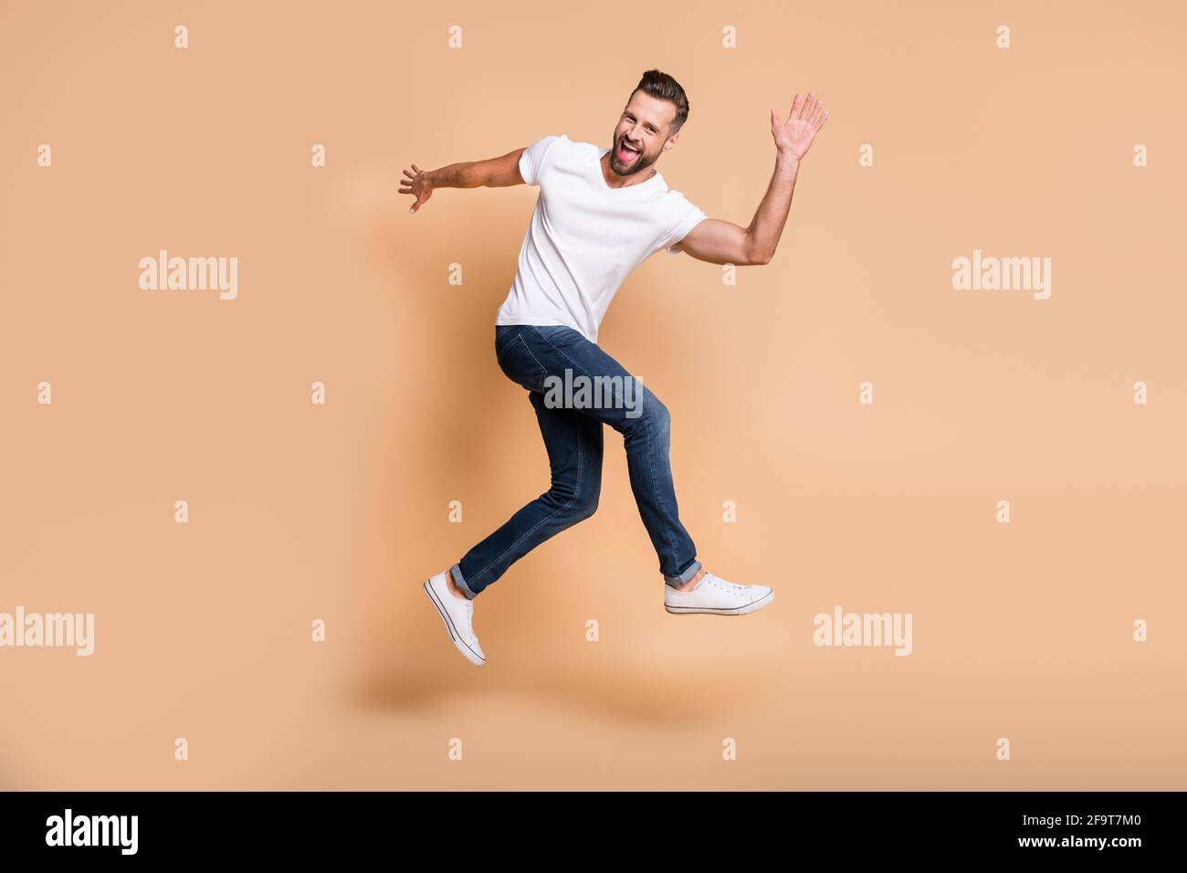 Full length body size view of attractive funky cheerful guy jumping ...