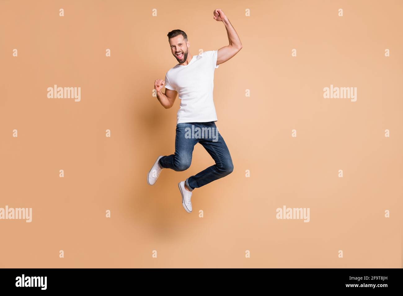 Full length body size view of nice tall cheerful macho guy jumping ...