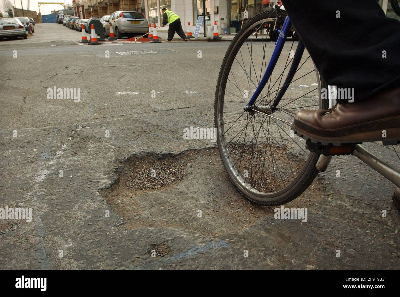 Bikes and Potholes 2/2/07 Tom Pilston Stock Photo - Alamy