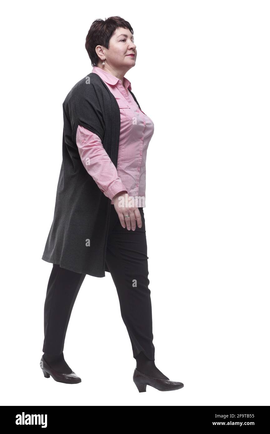 side view . confident adult woman striding forward Stock Photo - Alamy