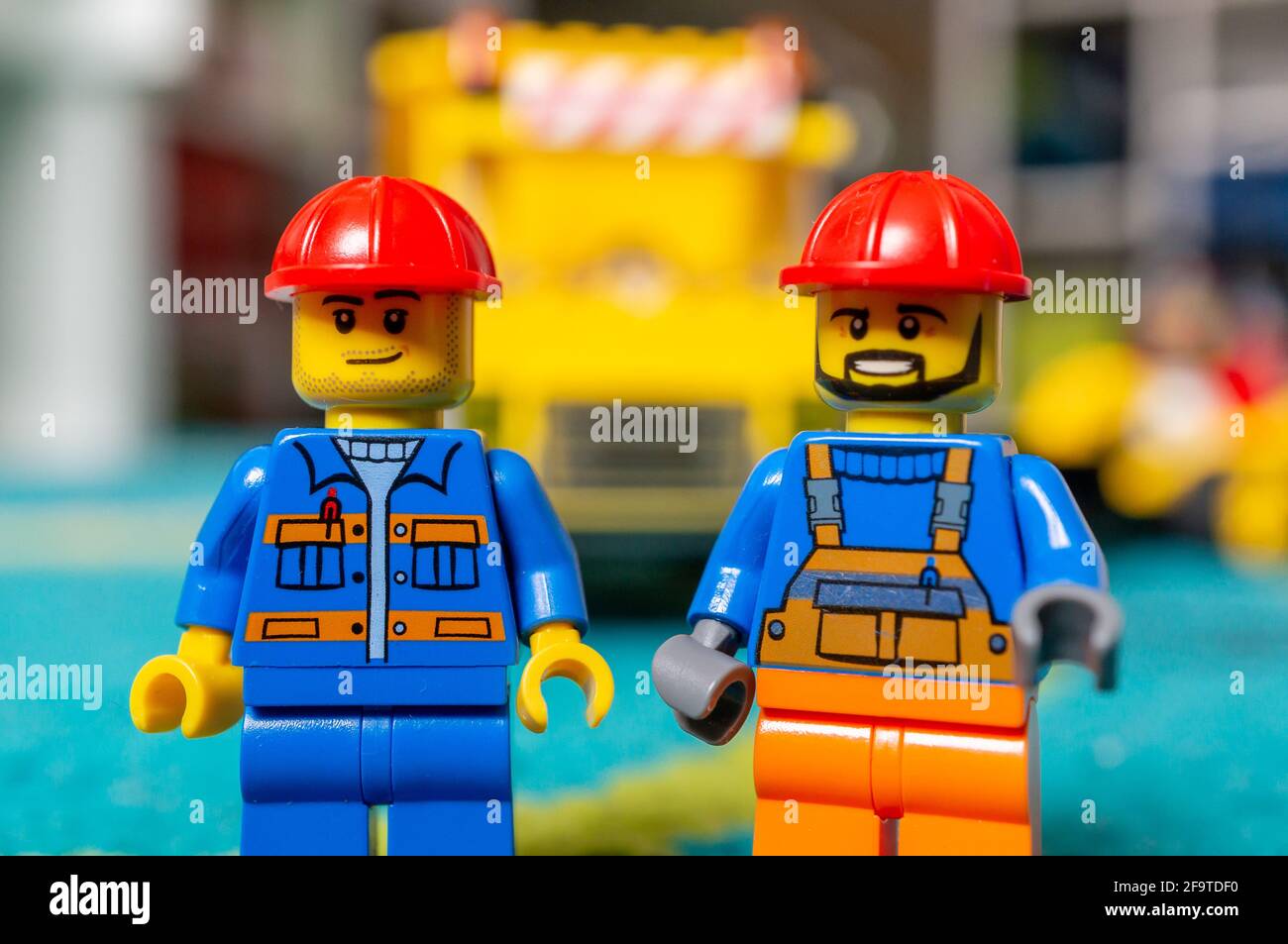 POZNAN, POLAND - Apr 17, 2021: Two Lego construction workers wearing a ...