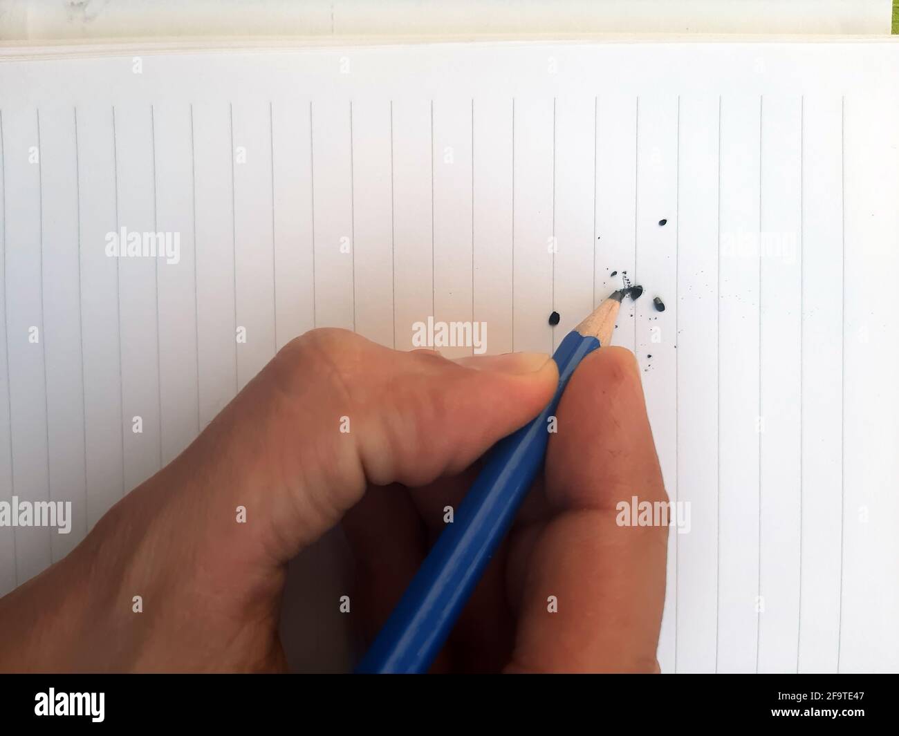 Broken graphite pencil. Writting with broken pencil Stock Photo - Alamy