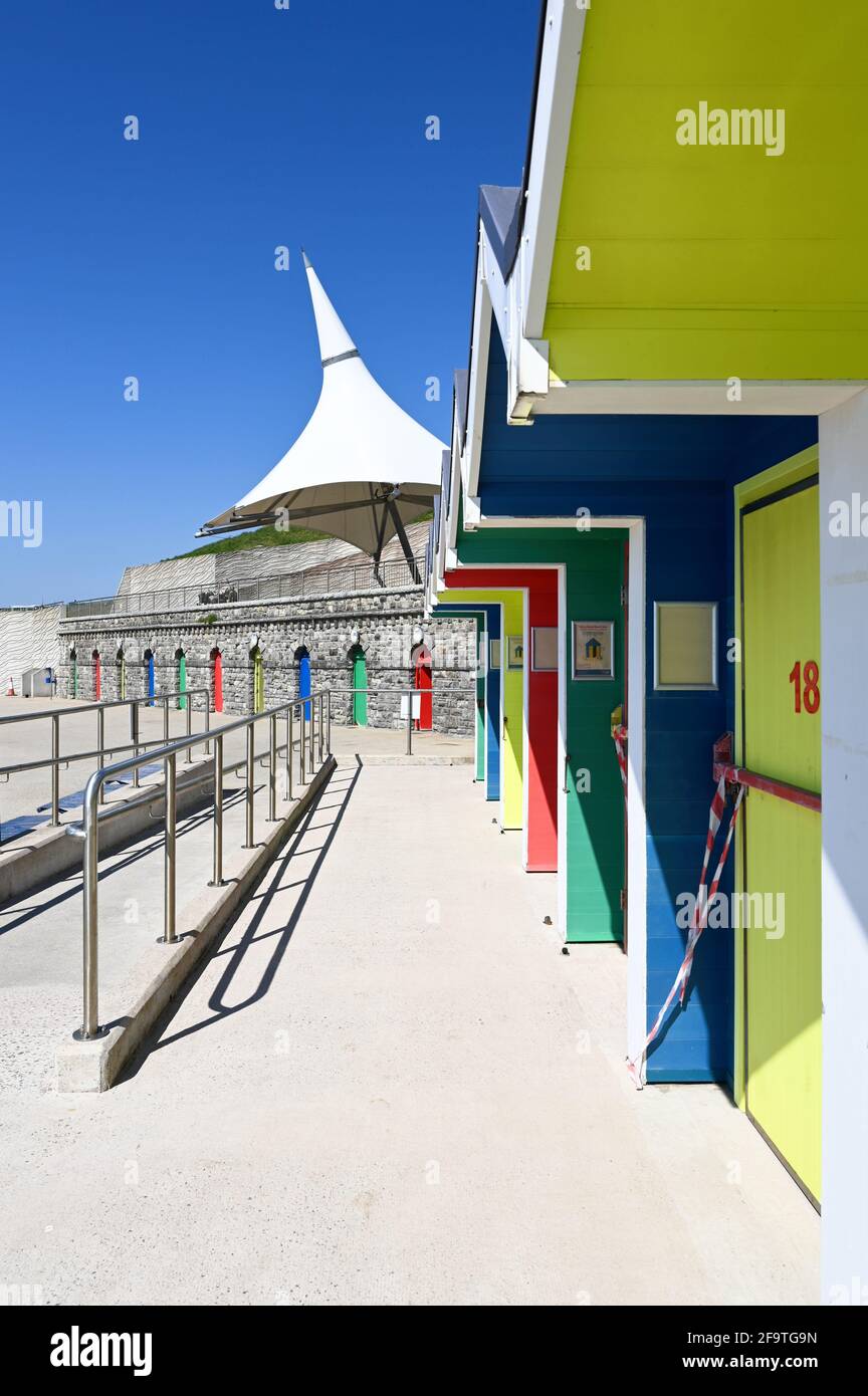 Barry Island, Wales, UK - April 17, 2021: A row of colorful beach huts ...