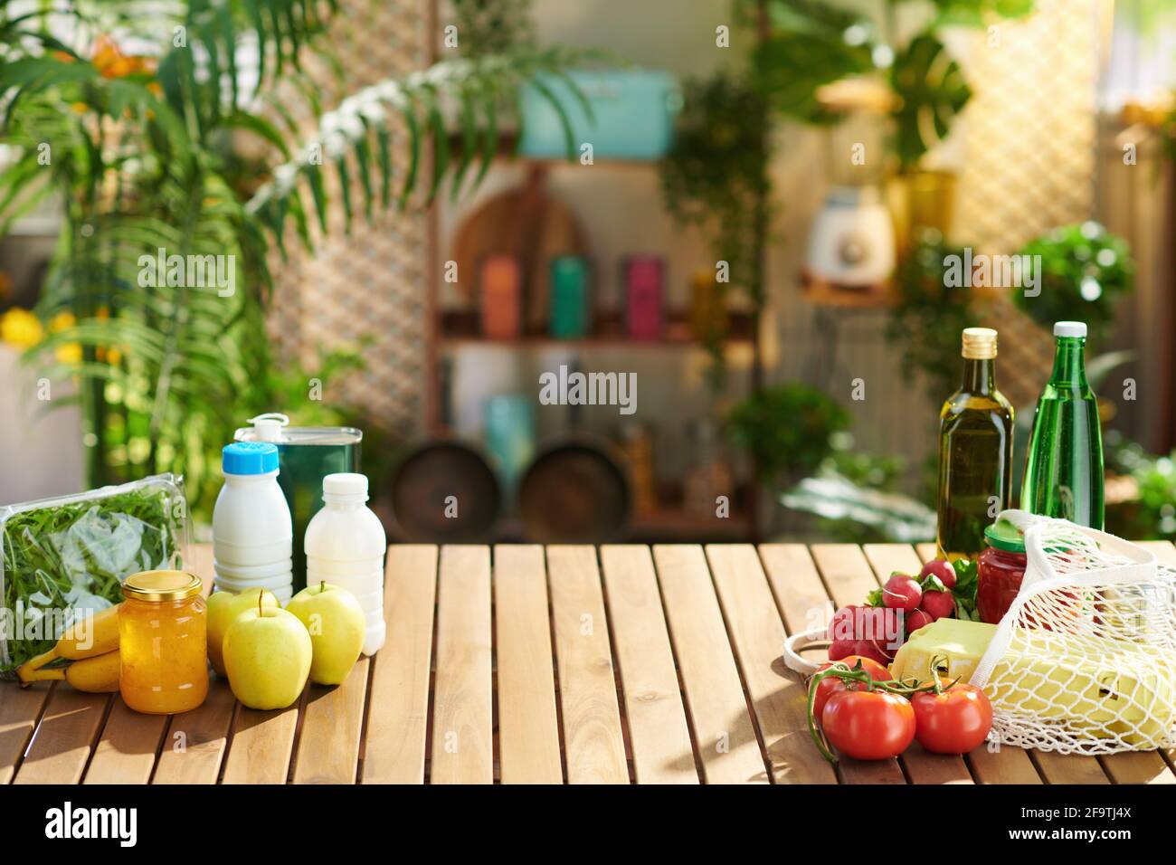 table with groceries in modern kitchen Stock Photo - Alamy