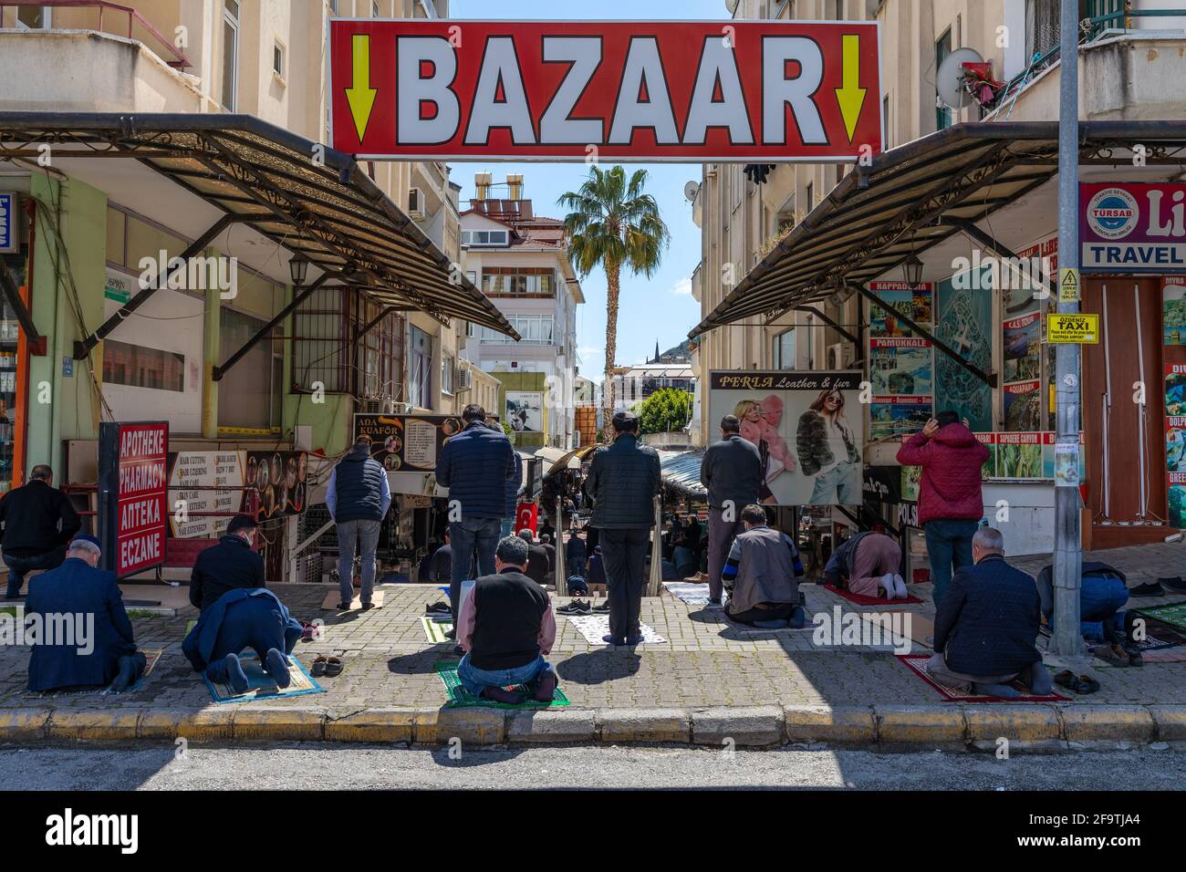 People praying in the street of Alanya bazaar during the coronavirus ...
