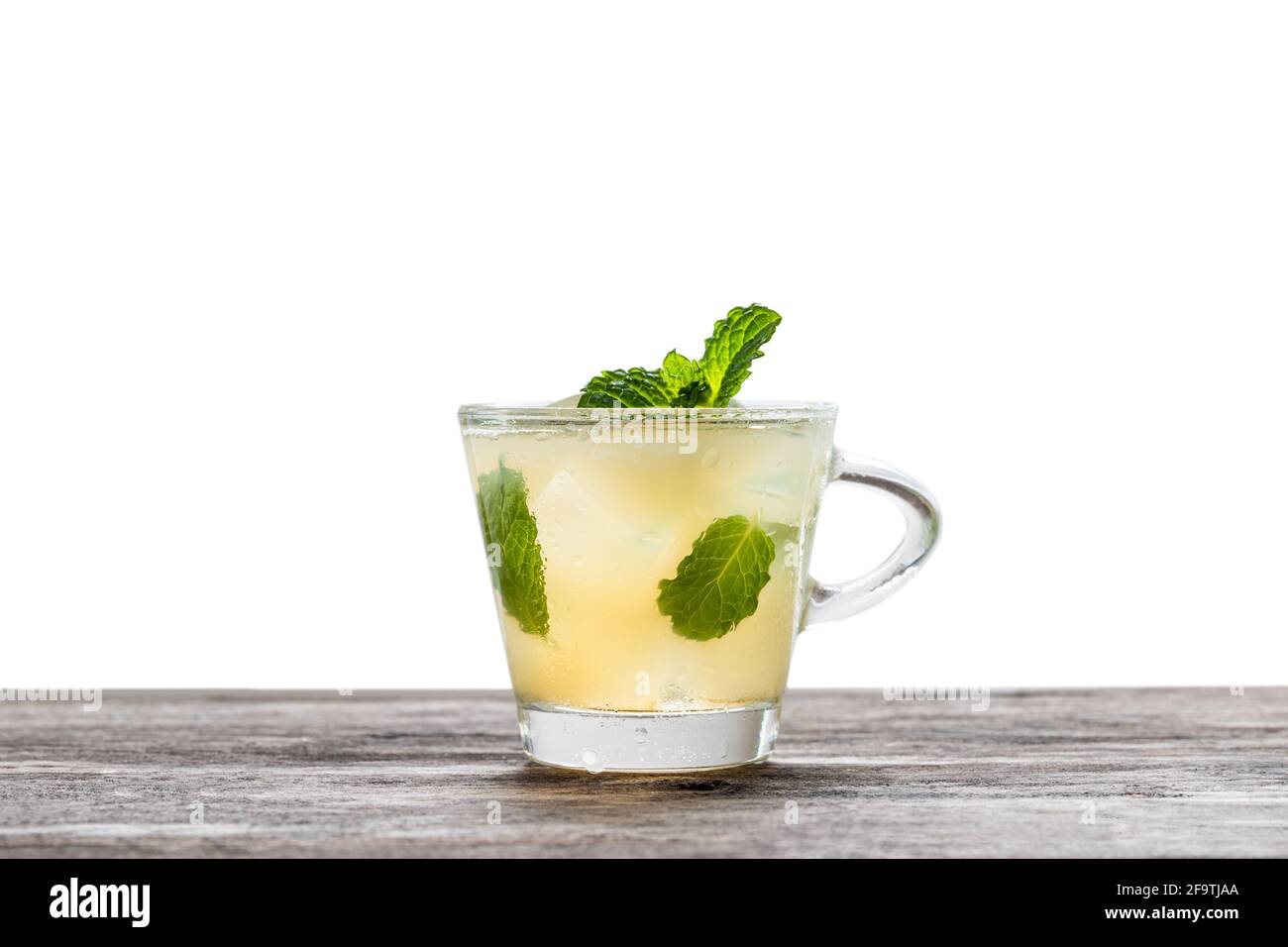 Green tea with ice in glass cup isolated on white Stock Photo - Alamy
