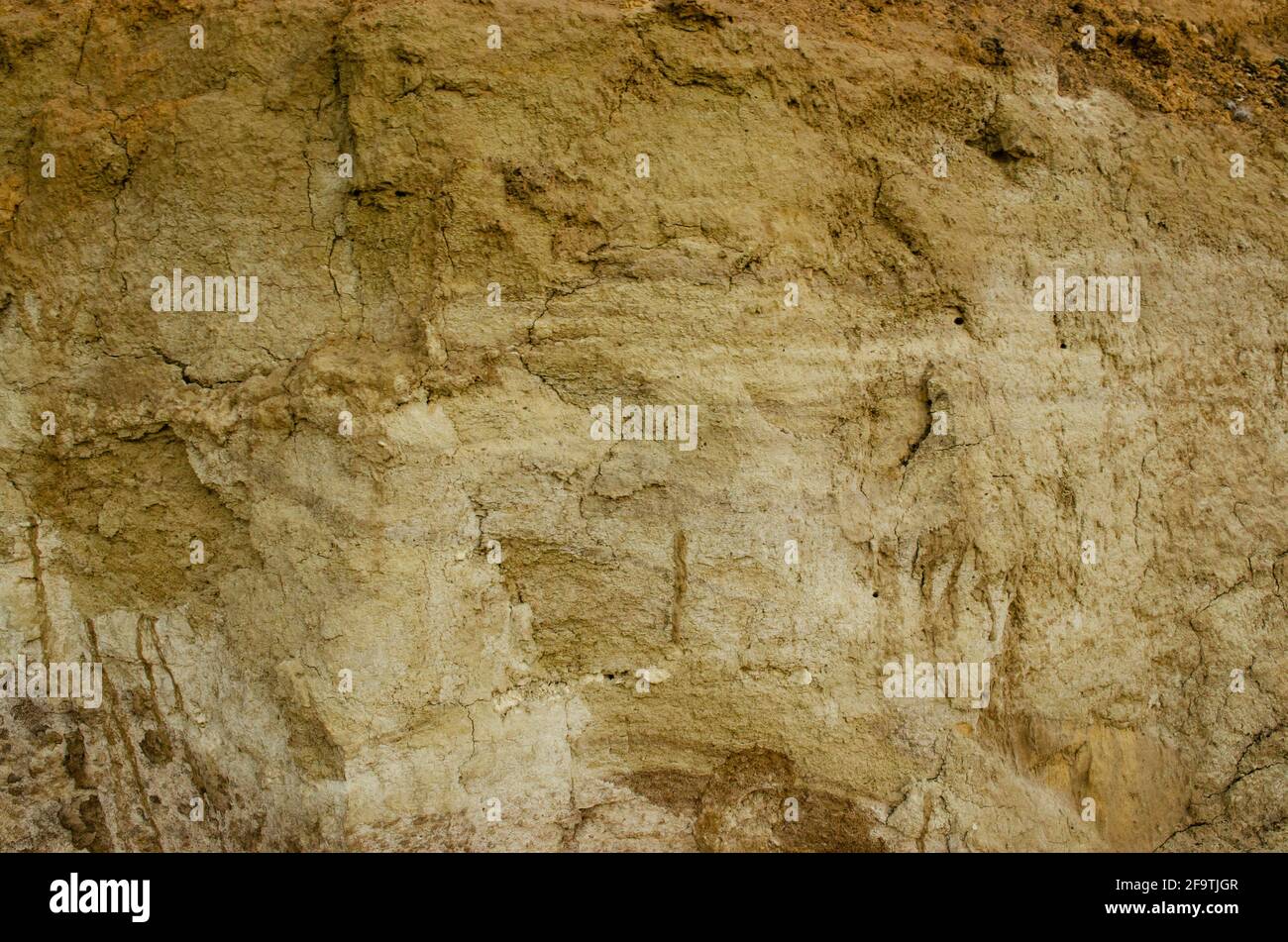 Natural background - vertical wall of sand in sand pit. soil texture ...