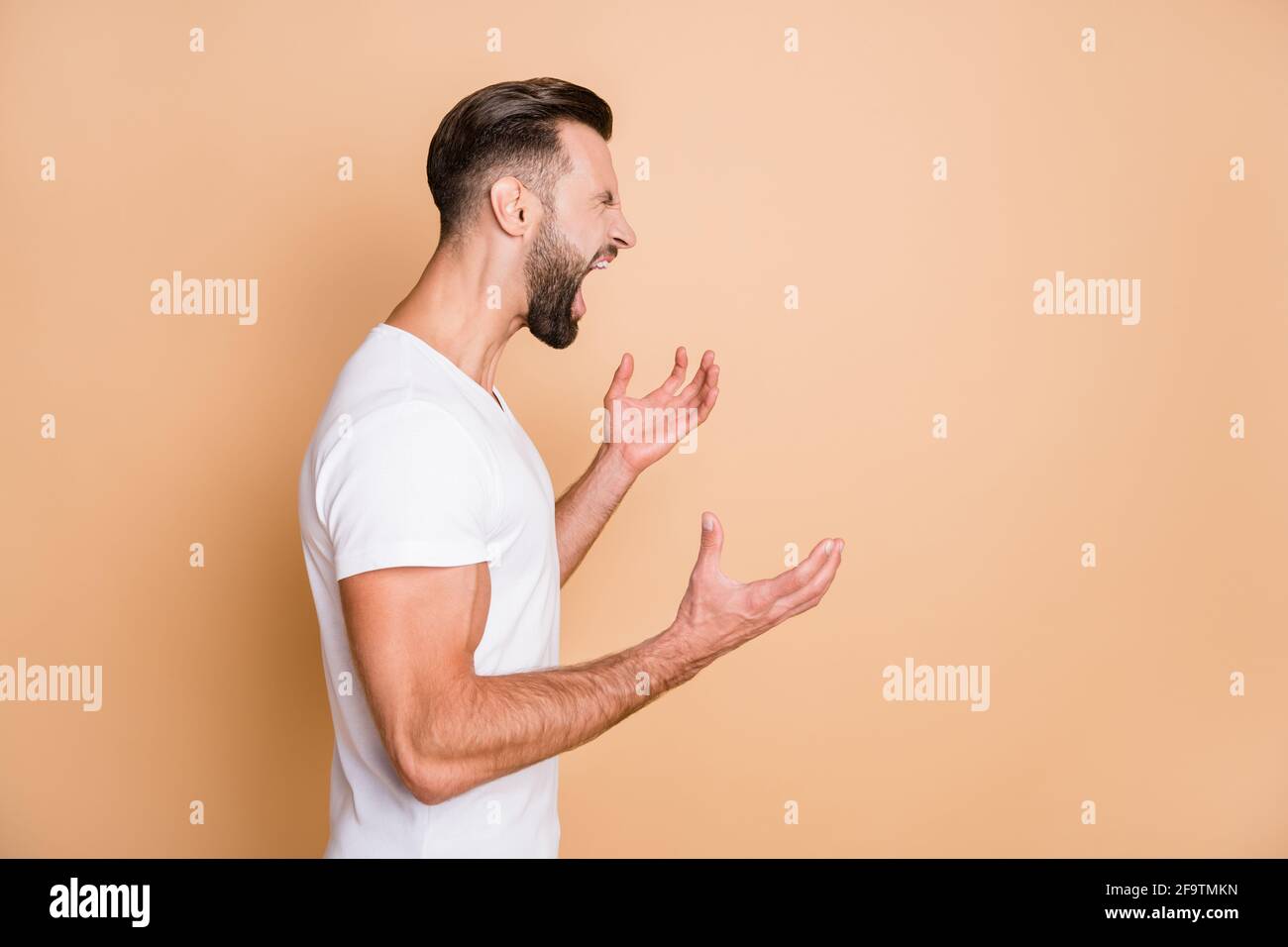 Profile side of young man unhappy angry mad aggressive quarrel problem ...