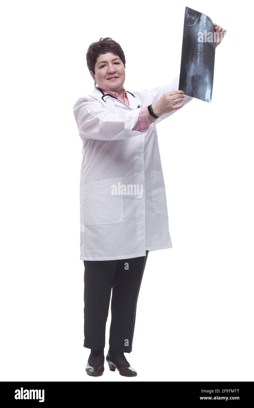 in full growth. a smiling female doctor examining an x -ray of a ...