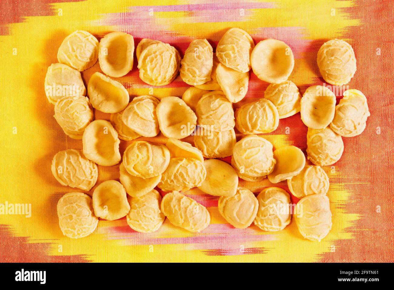 Orecchiette pasta on colored cloth ,a small ear shape pasta with the ...