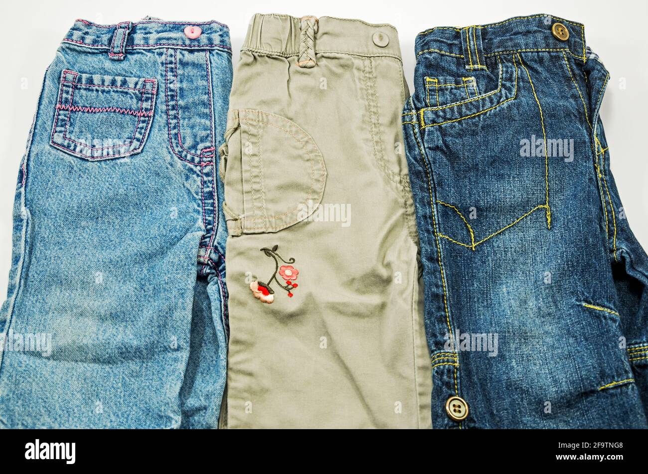 Set of denim pants for children aged 1-3 years isolated on white ...