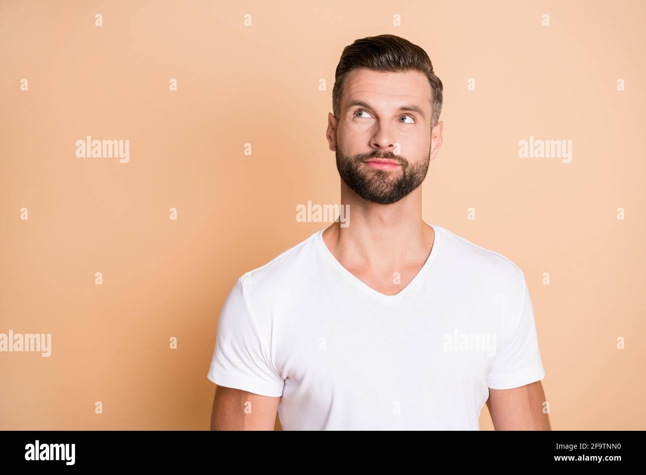 Photo of young handsome bristle man happy curious look empty space ...