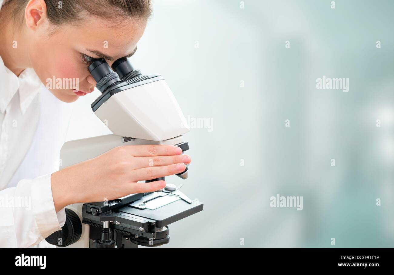 Scientist researcher using microscope in laboratory. Medical healthcare ...