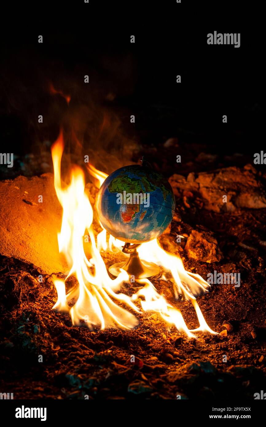 Globe in fire circle in abandoned space. Parallel to 2020 year Stock ...