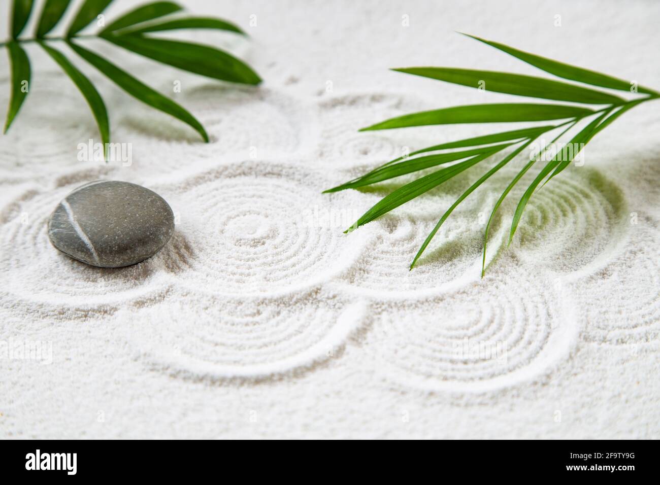 Mini zen garden with white sand pattern Stock Photo - Alamy