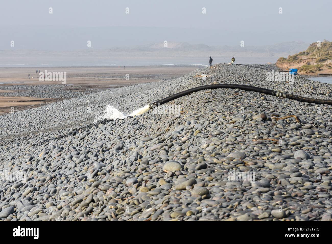 Large pipe drains overflow water from a flooded area Stock Photo - Alamy