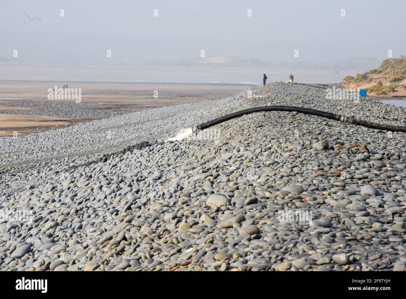 Large pipe drains overflow water from a flooded area Stock Photo - Alamy