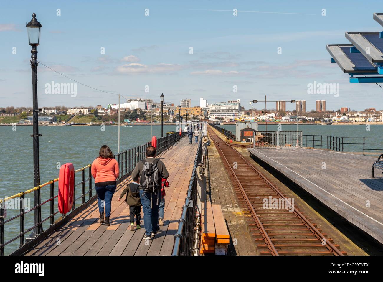 People walking on Southend Pier, heading towards the town of Southend ...