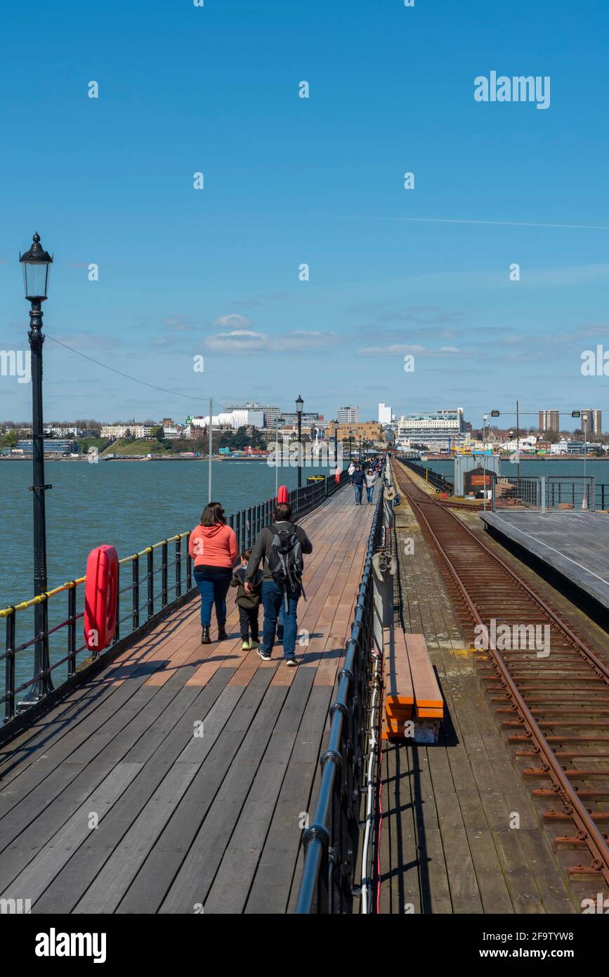 People walking on Southend Pier, heading towards the town of Southend ...