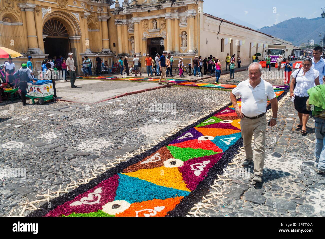 ANTIGUA, GUATEMALA - MARCH 27, 2016: People walk along decorative ...