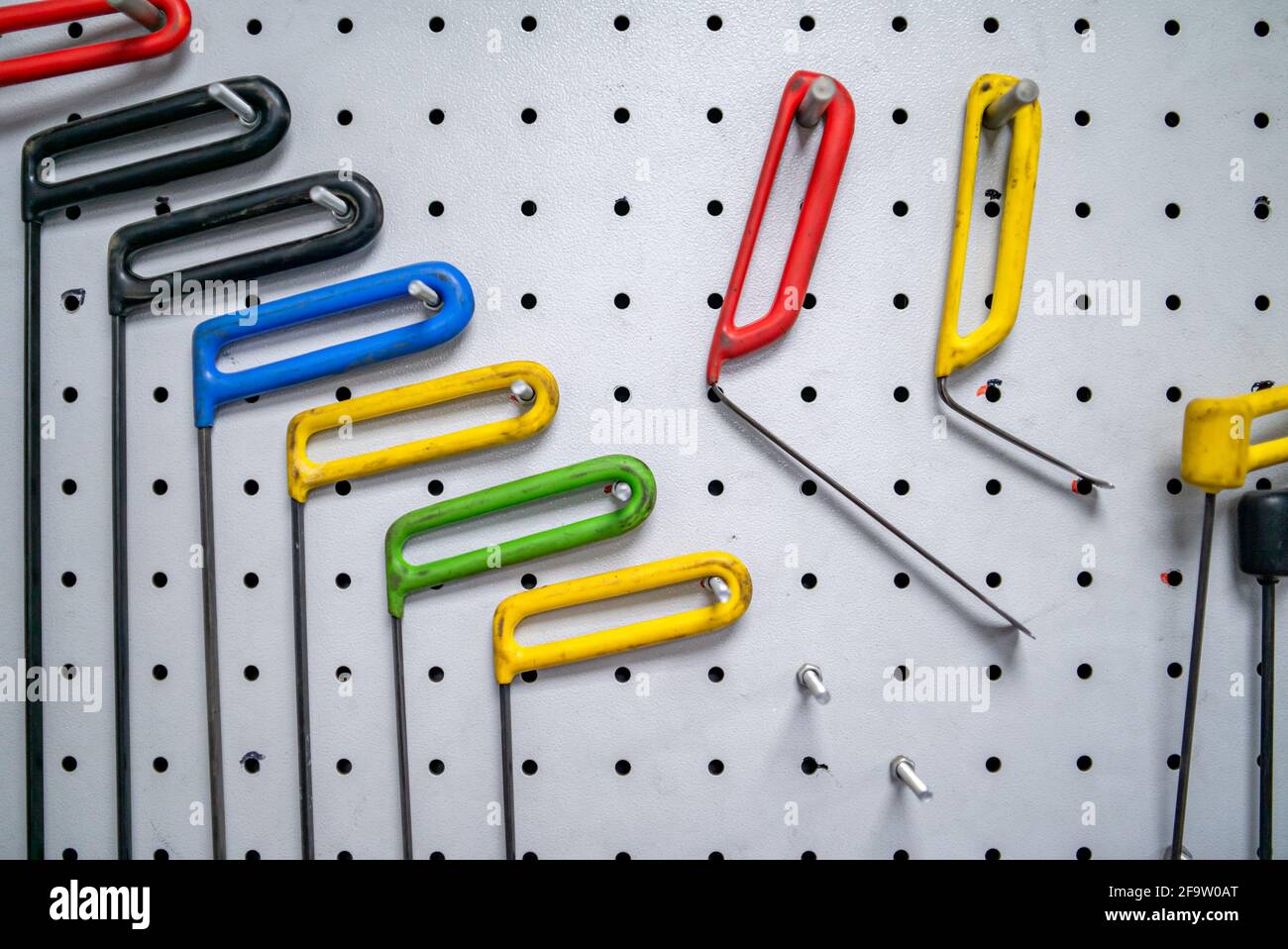 Bright colored special hooks using in PDR work process to remove dents ...
