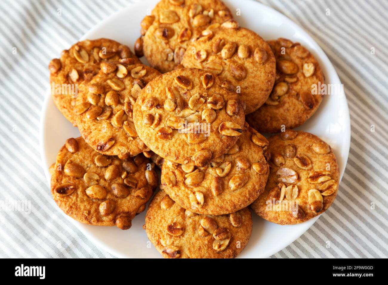 Homemade Cookies with Peanuts on a white plate, side view. Close-up ...