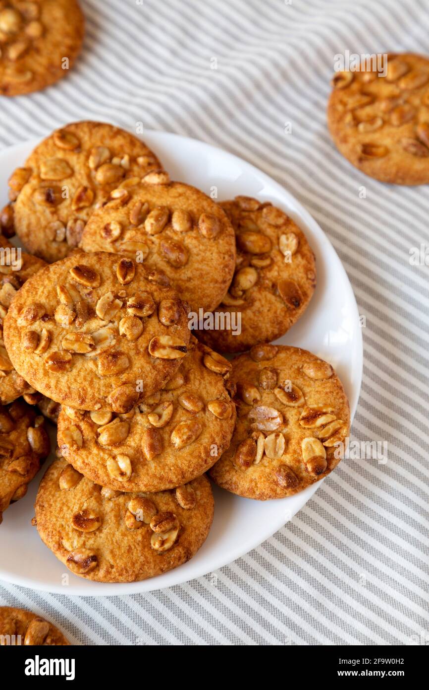 Homemade Cookies with Peanuts on a white plate, side view Stock Photo ...