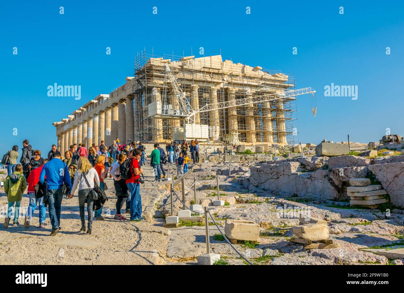 ATHENS, GREECE, DECEMBER 10, 2015: Many tourists visiting ancient temple Parthenon on Acropolis ...