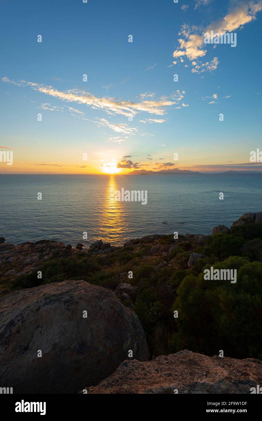 Vertical view of a sunrise at Horseshoe Bay, Bowen, Queensland, QLD ...