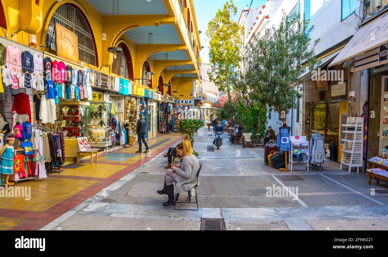 ATHENS, GREECE, DECEMBER 10, 2015: View of a narrow shopping street in ...
