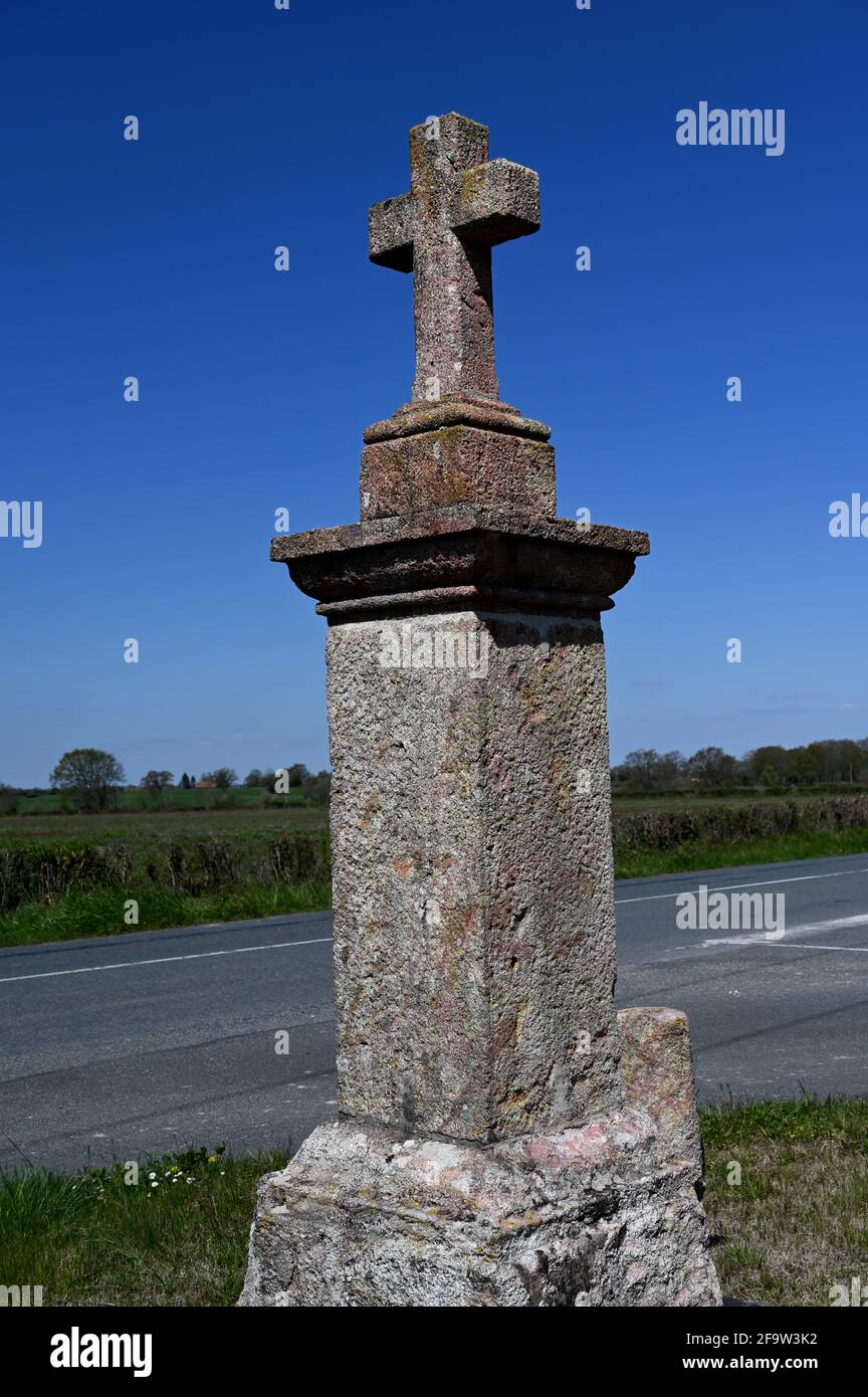 A sandstone christian cross in french countryside Stock Photo - Alamy
