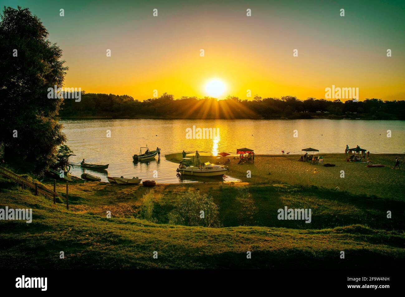 Sunset and beach in front of the Uruguay River. Colón, Entre Ríos ...