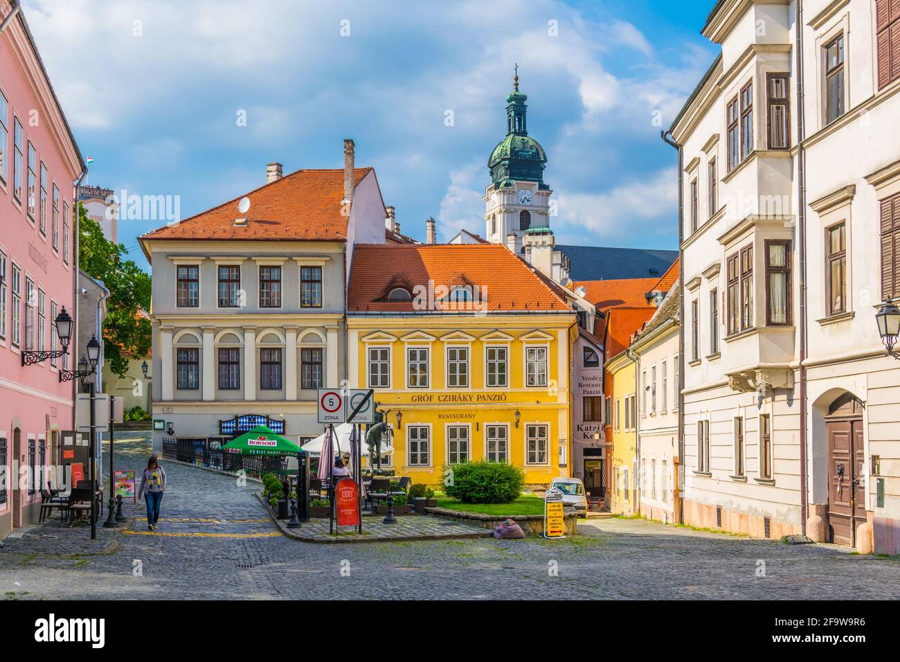 GYOR, HUNGARY MAY 20, 2016: People are walking through a narrow street ...